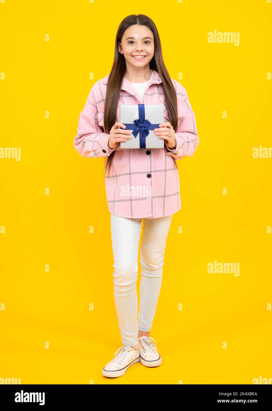 Teenager kid with present box. Teen child girl giving birthday gift ...