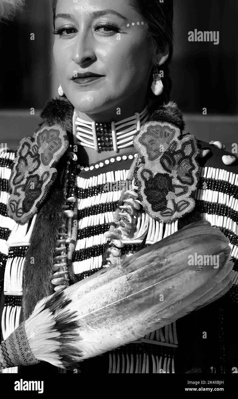 A Native American woman (see additional information) poses for photos ...