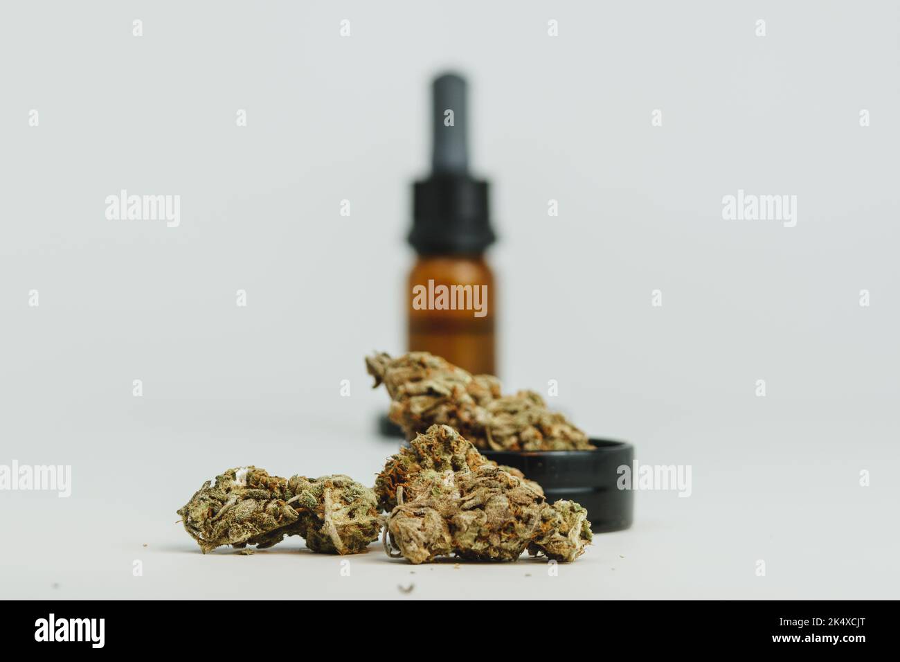 Marijuana buds on white background, close up. Cannabis is a herbal or ...