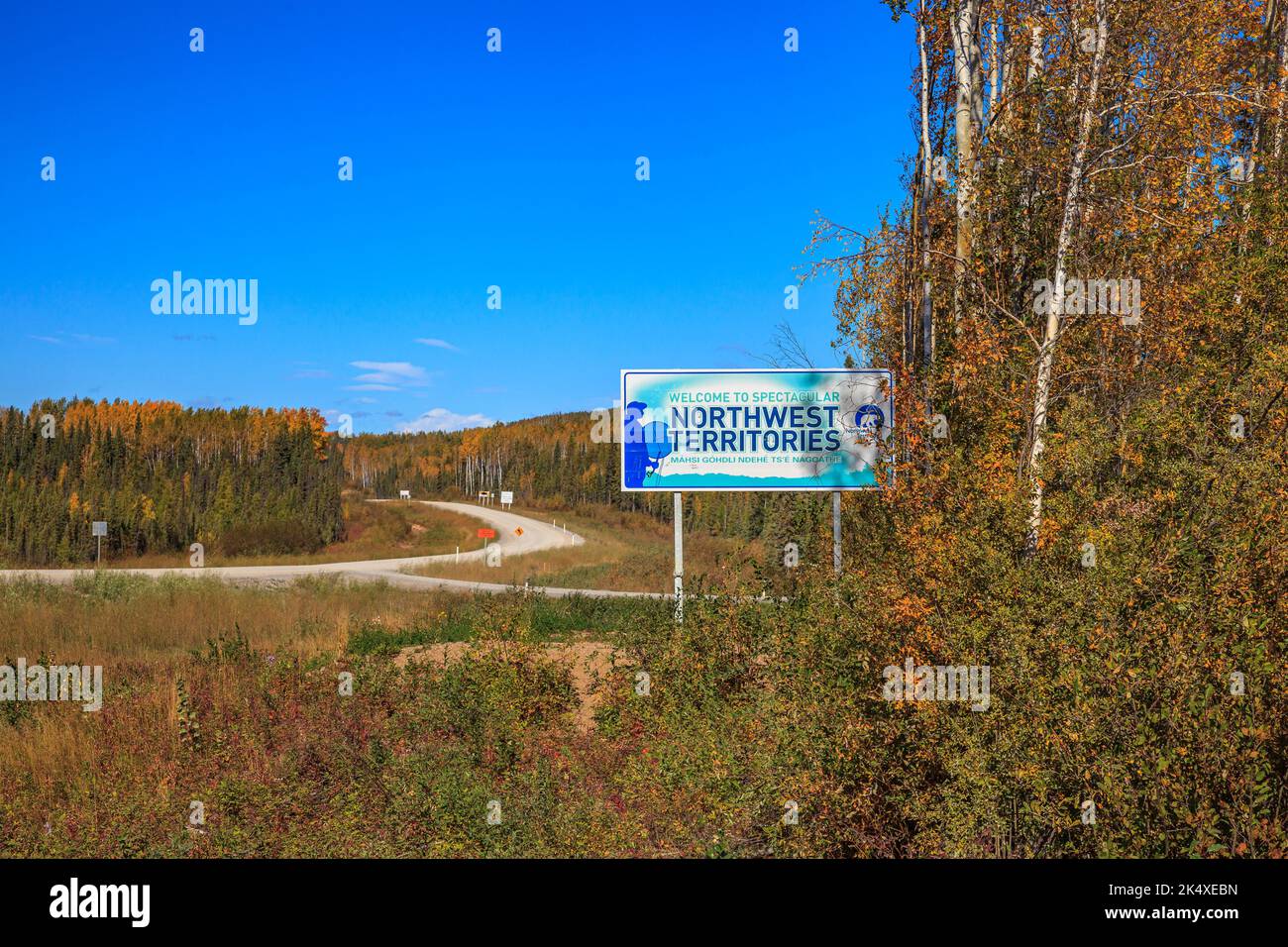 A sign welcoming visitors to the Northwest Territories as the Liard ...