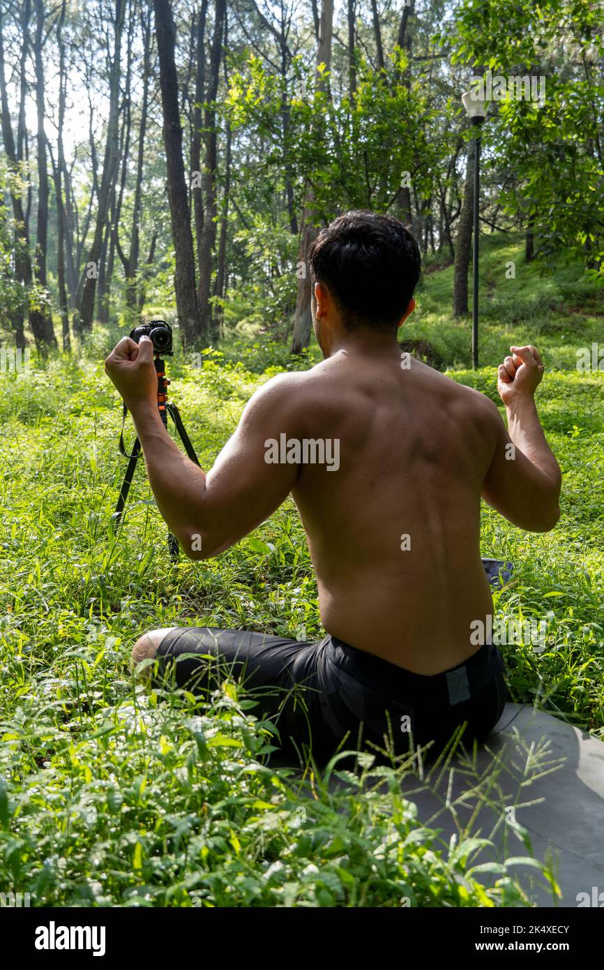 Millennial guy meditating with trainer online via tablet ipad ... Millennial guy meditating with trainer online via tablet ipad ...