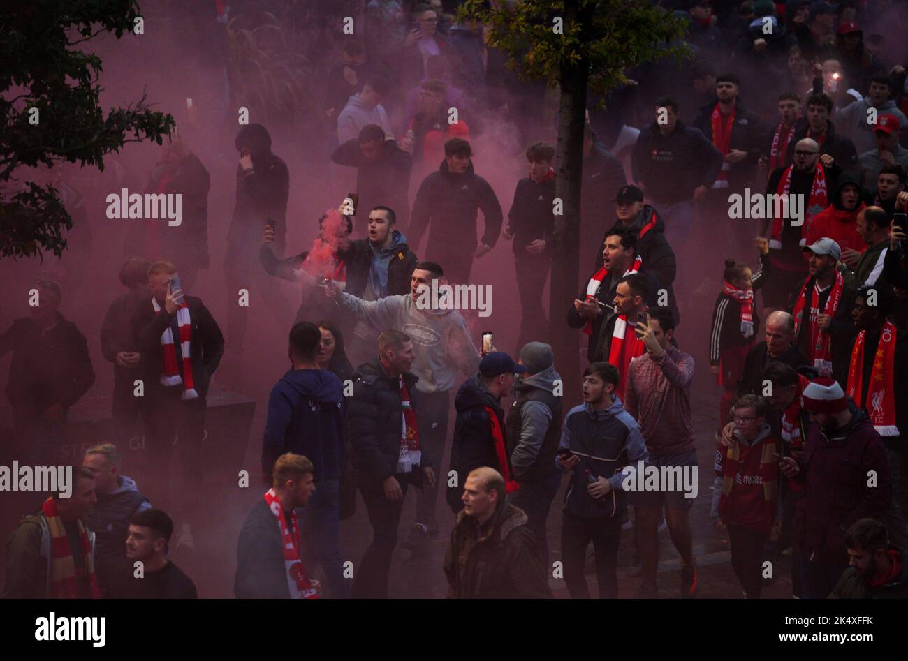 Liverpool fans set off flares as they arrive for the UEFA Champions ...