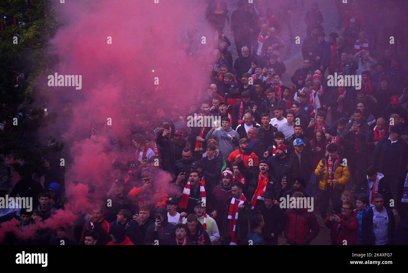 Liverpool fans set off flares as they arrive for the UEFA Champions ...