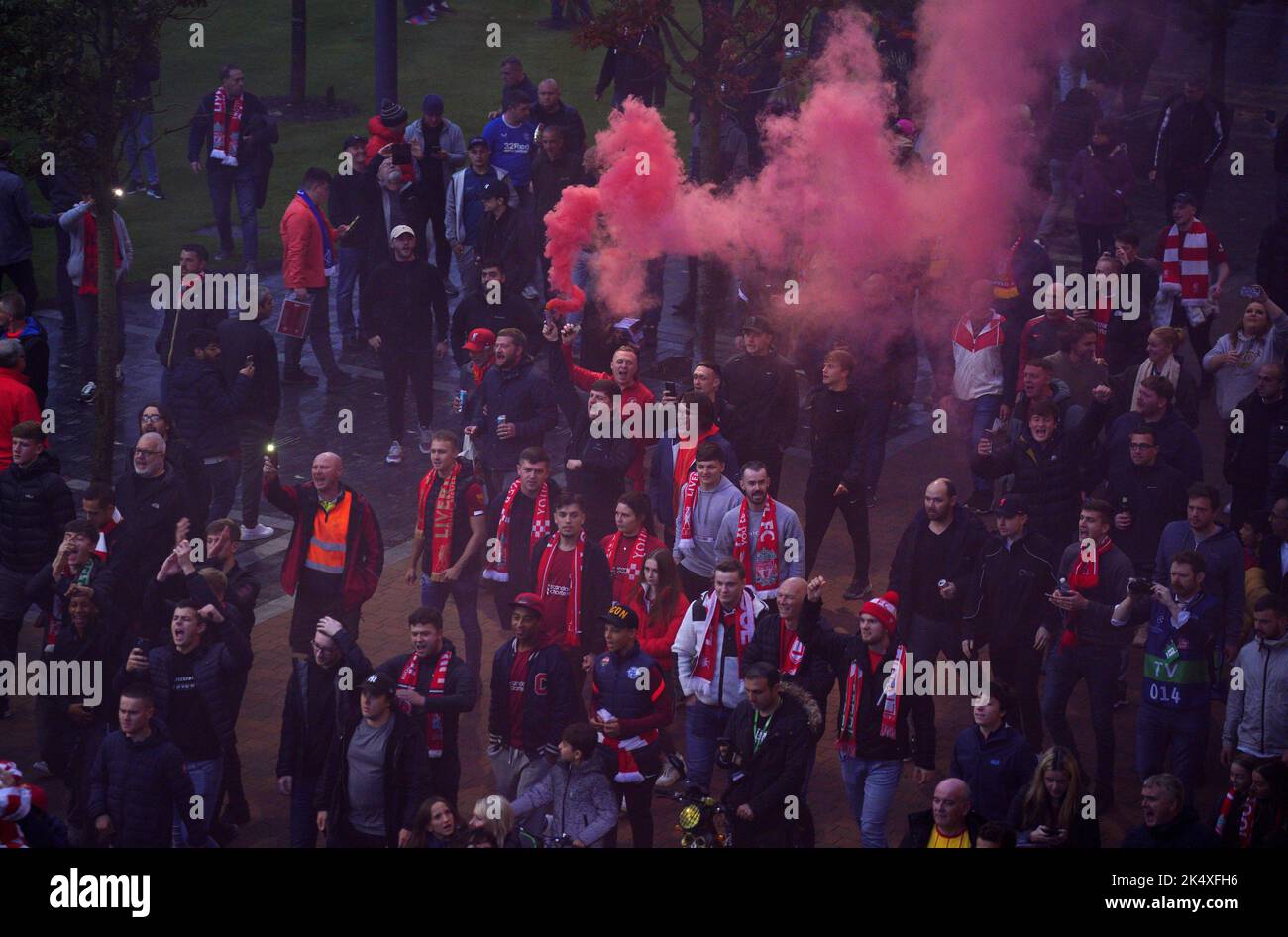 Liverpool fans set off flares as they arrive for the UEFA Champions ...