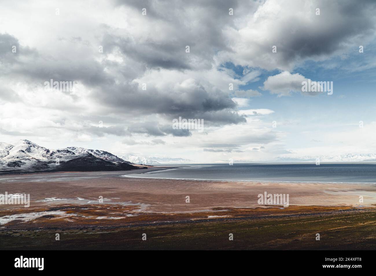 A beautiful view of Great Salt Lake and puffy clouds in the sky in ...