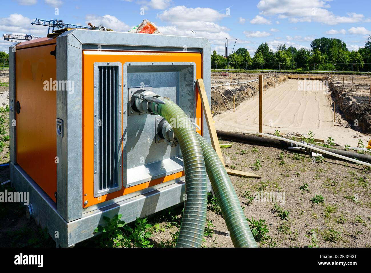 Large Portable Electric Water Pump With Hose For Dewatering The Deep Pit Of The Building