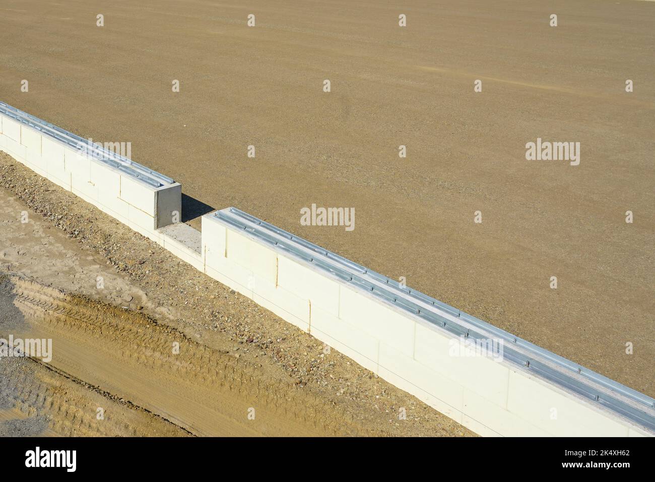 prepared base and concrete border for installation of inflatable ...