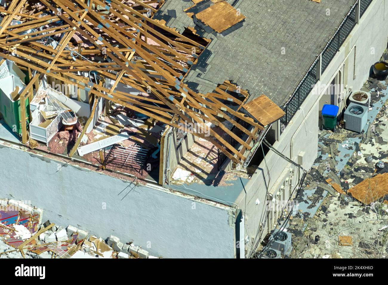 Hurricane Ian destroyed house roof in Florida residential area. Natural ...