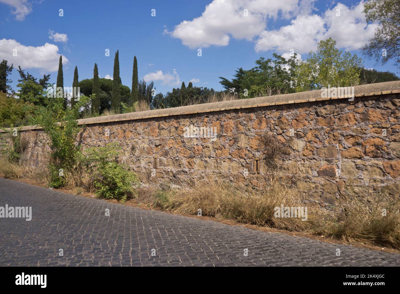 View of the ancient Appian Way Roman road near the catacombs christian burial grounds in Rome ...
