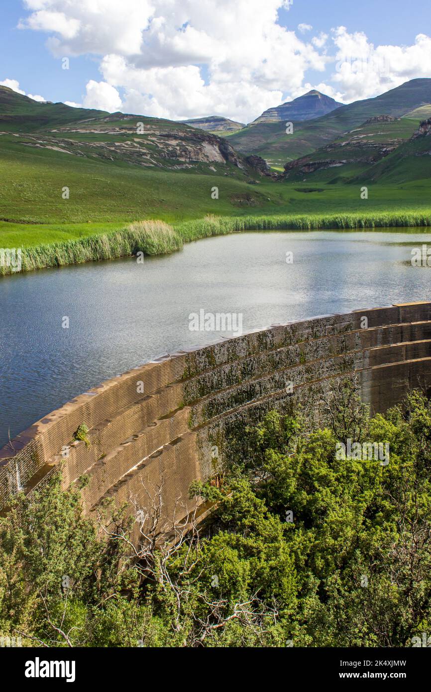 Picturesque view of the overflow at the dam wall of a small reservoir ...