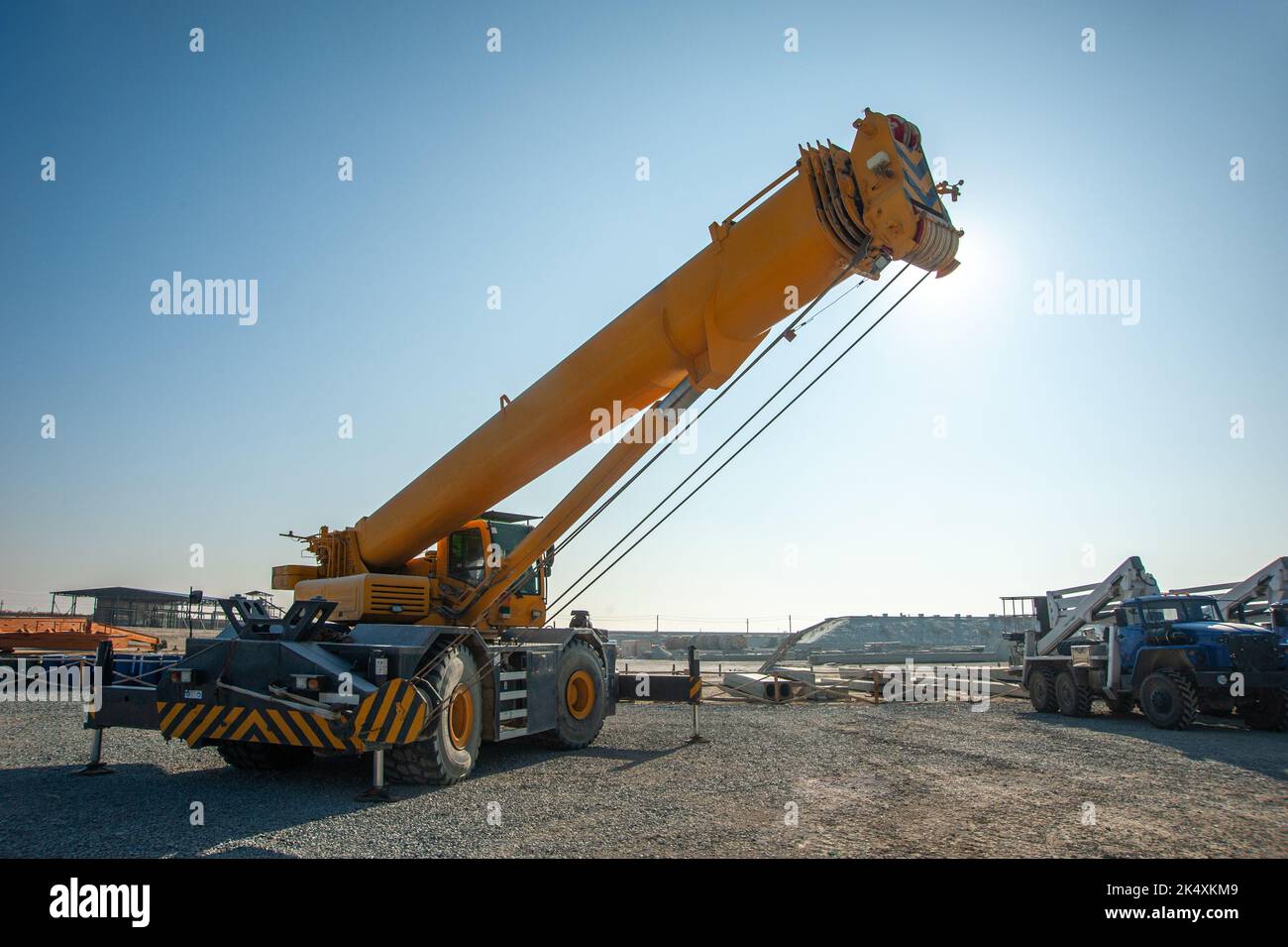 A Track crane working in a industrial construction area Stock Photo - Alamy