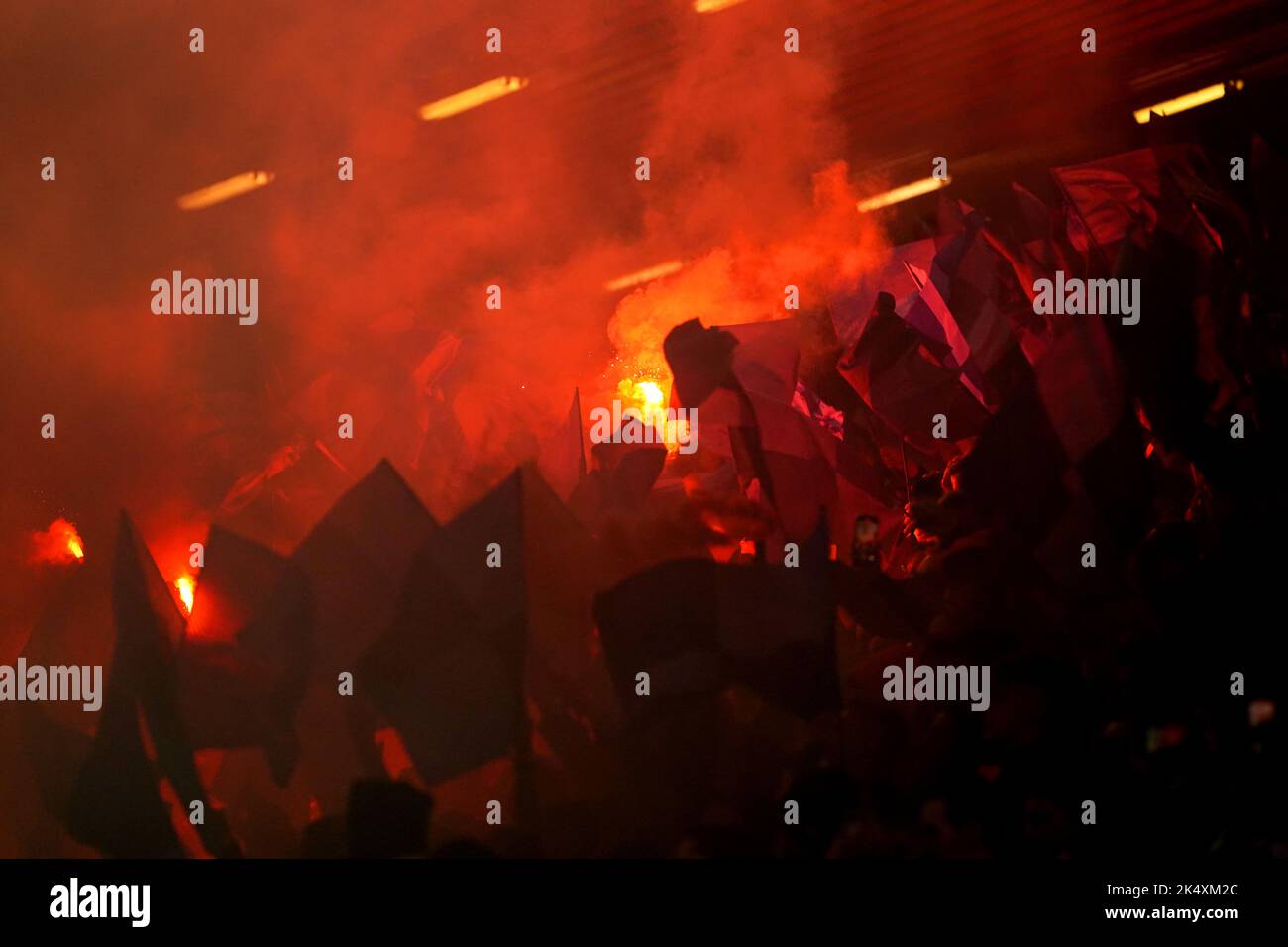 Fans set off flares in the stands ahead of the UEFA Champions League ...