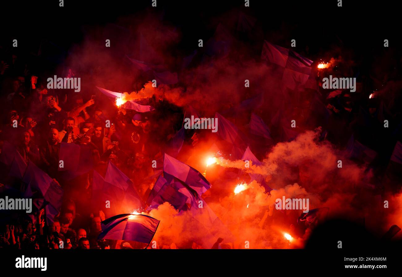 Fans let off flares in the stands during the UEFA Champions League ...