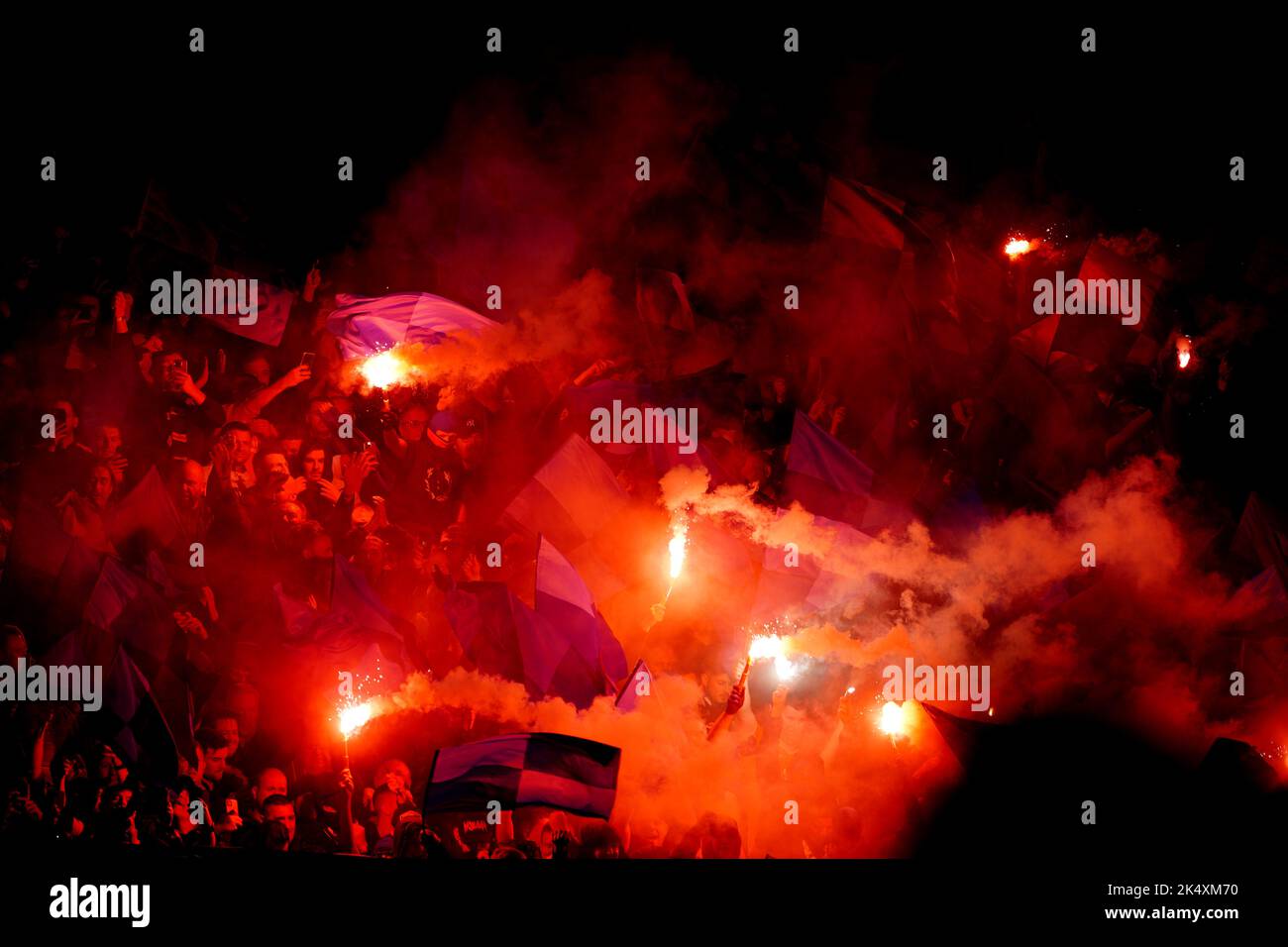 Fans let off flares in the stands during the UEFA Champions League ...