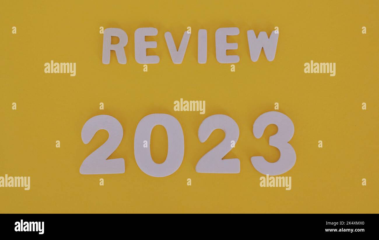 2023 review new year. on a yellow background Review 2023. Business, new ...