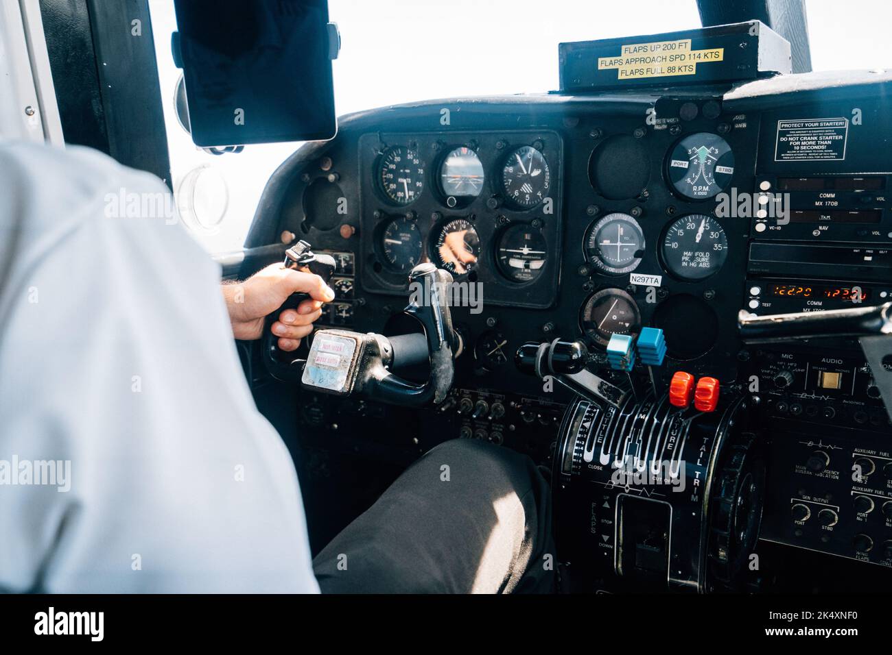 A plane cockpit and a pilot flying a private plane Stock Photo - Alamy