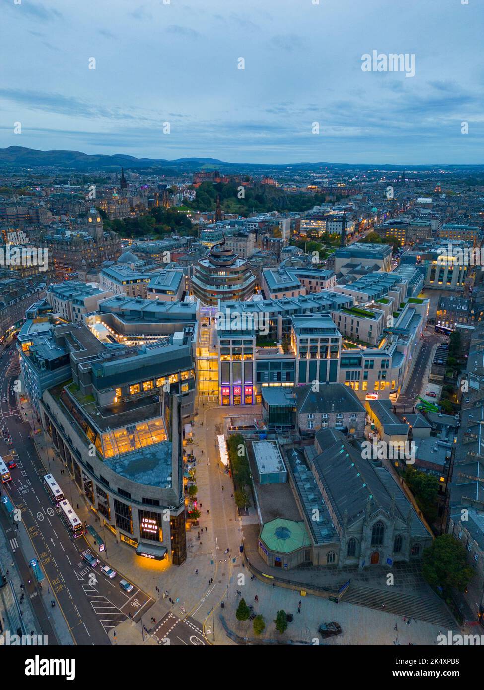Aerial view at dusk of St James Quarter and skyline of Edinburgh ...