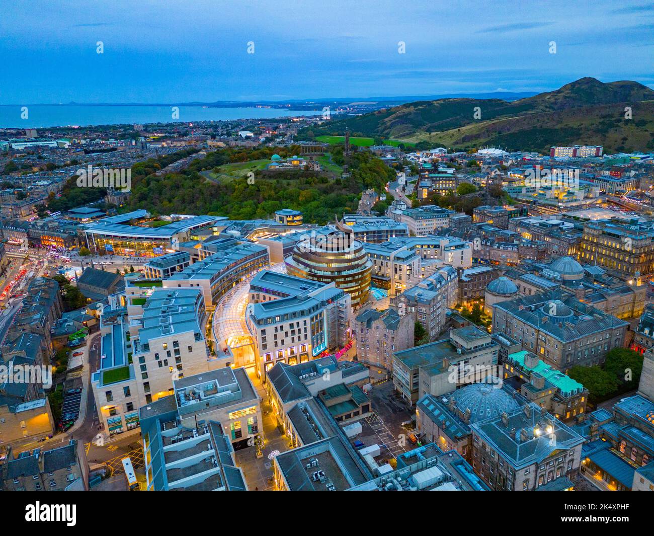 Aerial view at dusk of St James Quarter and skyline of Edinburgh ...