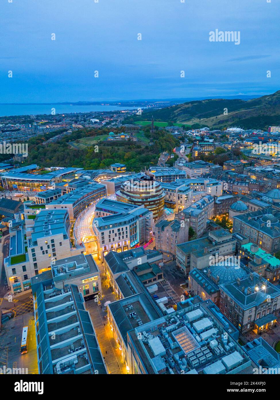 Aerial view at dusk of St James Quarter and skyline of Edinburgh ...