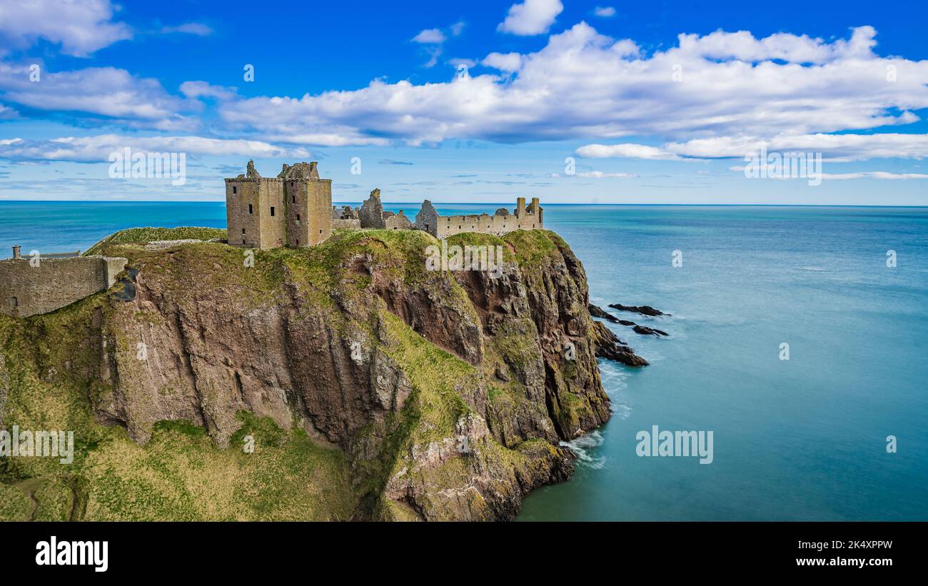 Dunnottar Castle Stonehaven taken from drone on sunny day with blue sky ...