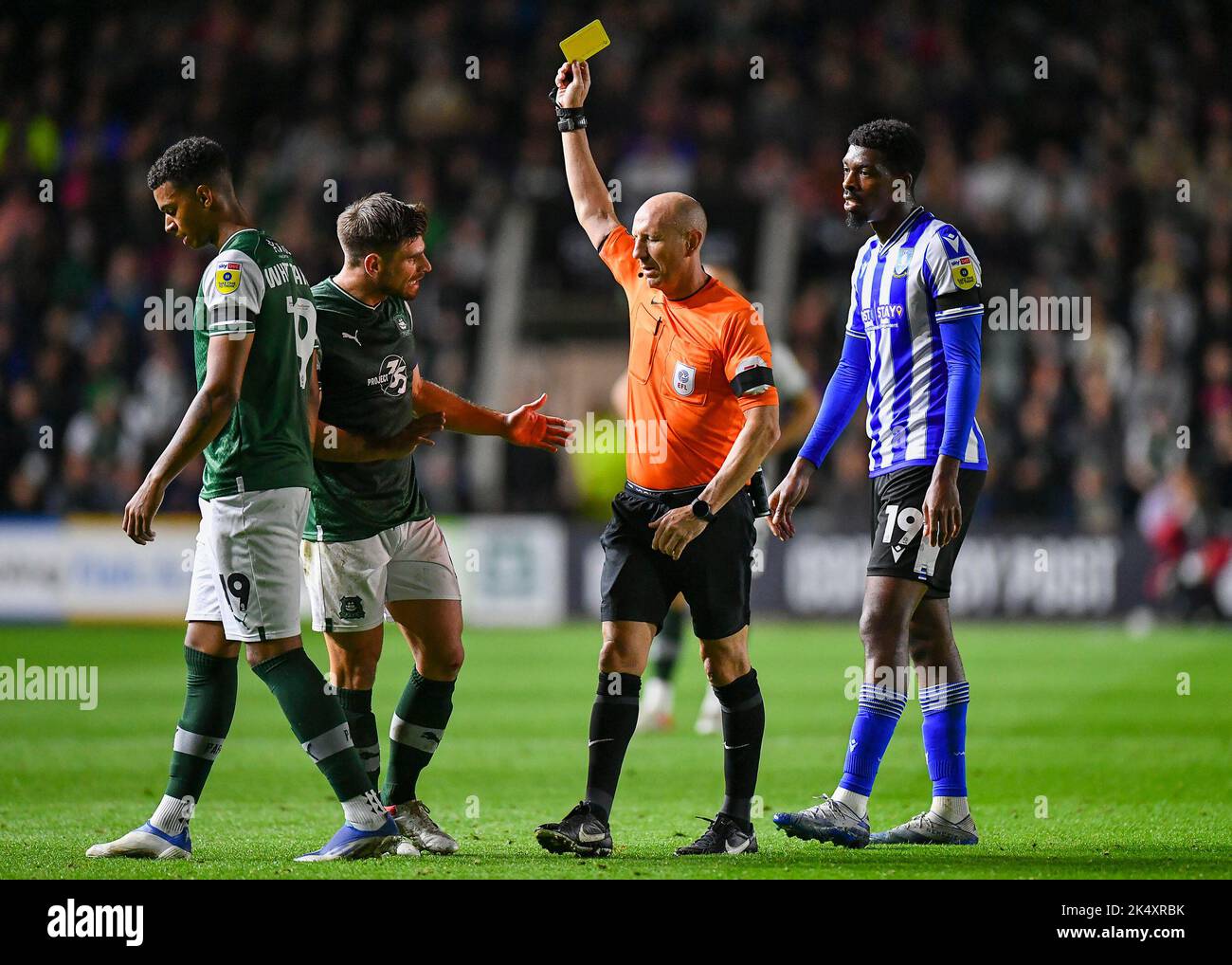 Plymouth Argyle midfielder Joe Edwards (8) receives a yellow card ...