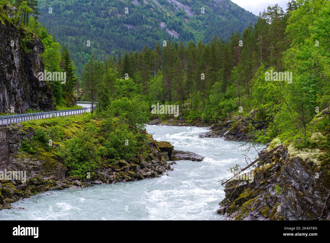 wild water river with some typical norwegian houses Stock Photo - Alamy