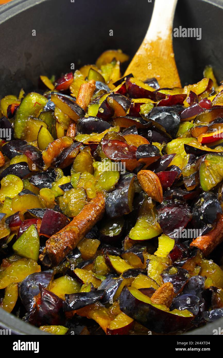 sliced pums in a pot ready to be cooked into homemade plum jam Stock ...