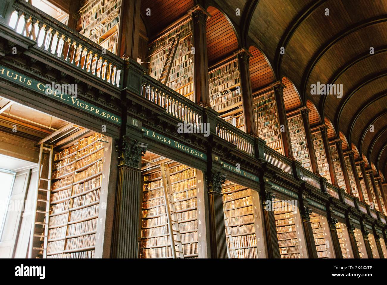 A beautiful view of an old library interior filled with books and ...