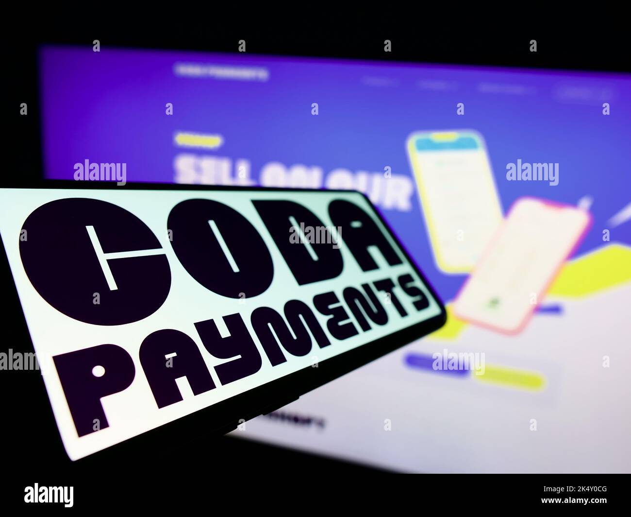 Smartphone with logo of financial company Coda Payments Pte. Ltd. on ...