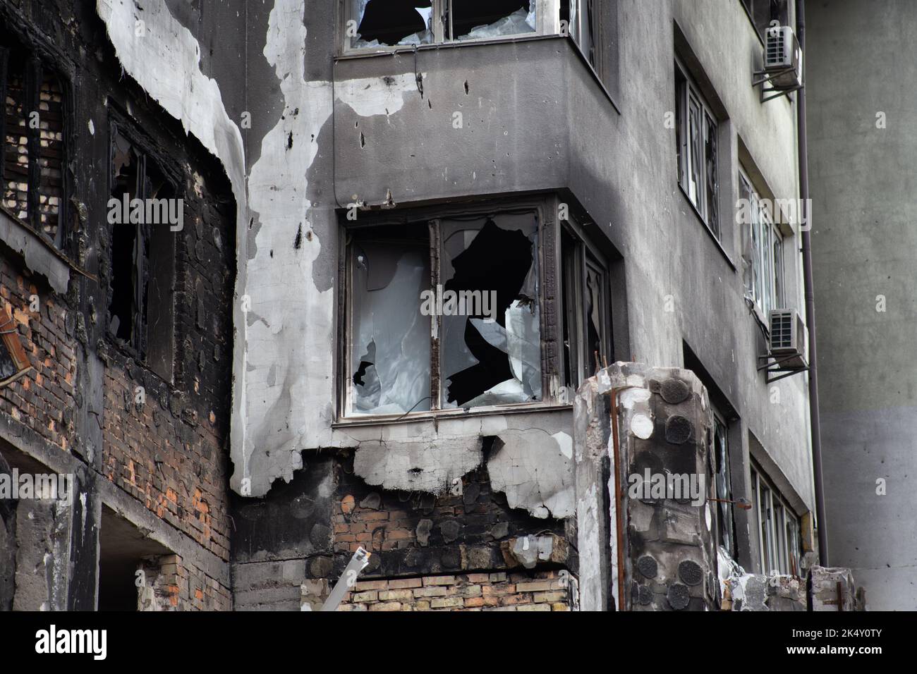 Broken windows in residential buildings in the city of Bucha in the ...
