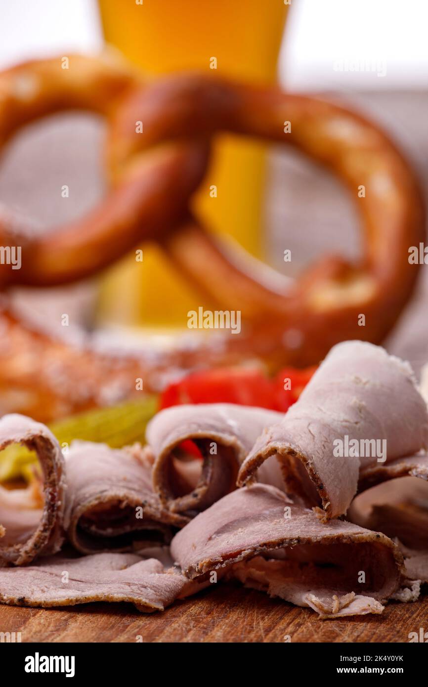 bavarian sliced cold pork on wood Stock Photo - Alamy