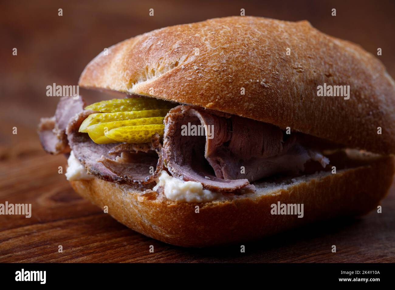 bavarian sliced cold pork in a bun Stock Photo - Alamy