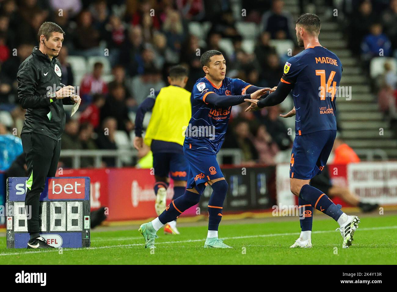 Ian Poveda #26 of Blackpool replaces Gary Madine #14 during the Sky Bet ...