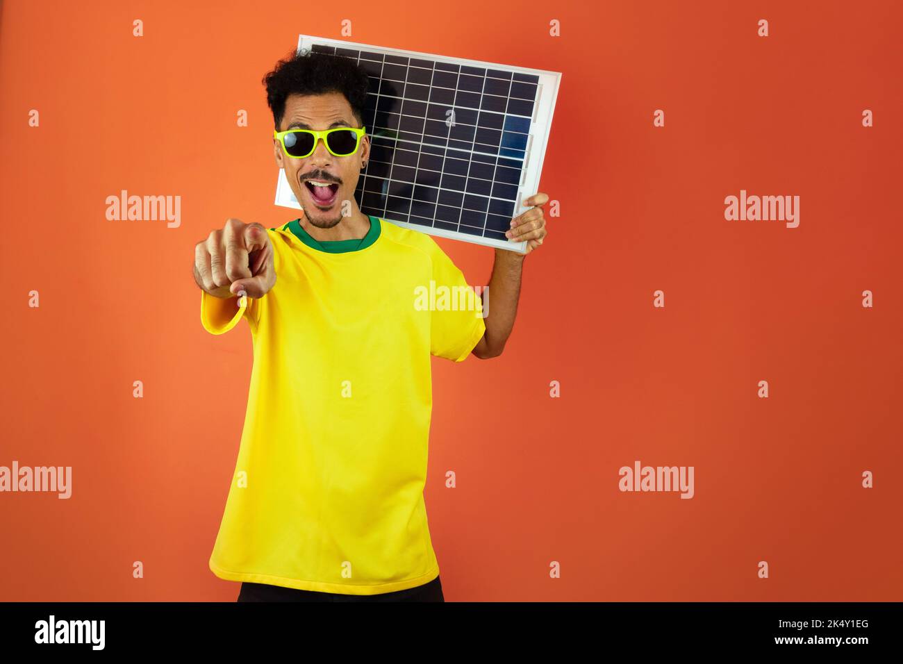 Soccer Player - Black Man Celebrating Holding Solar Photovoltaic Panel ...