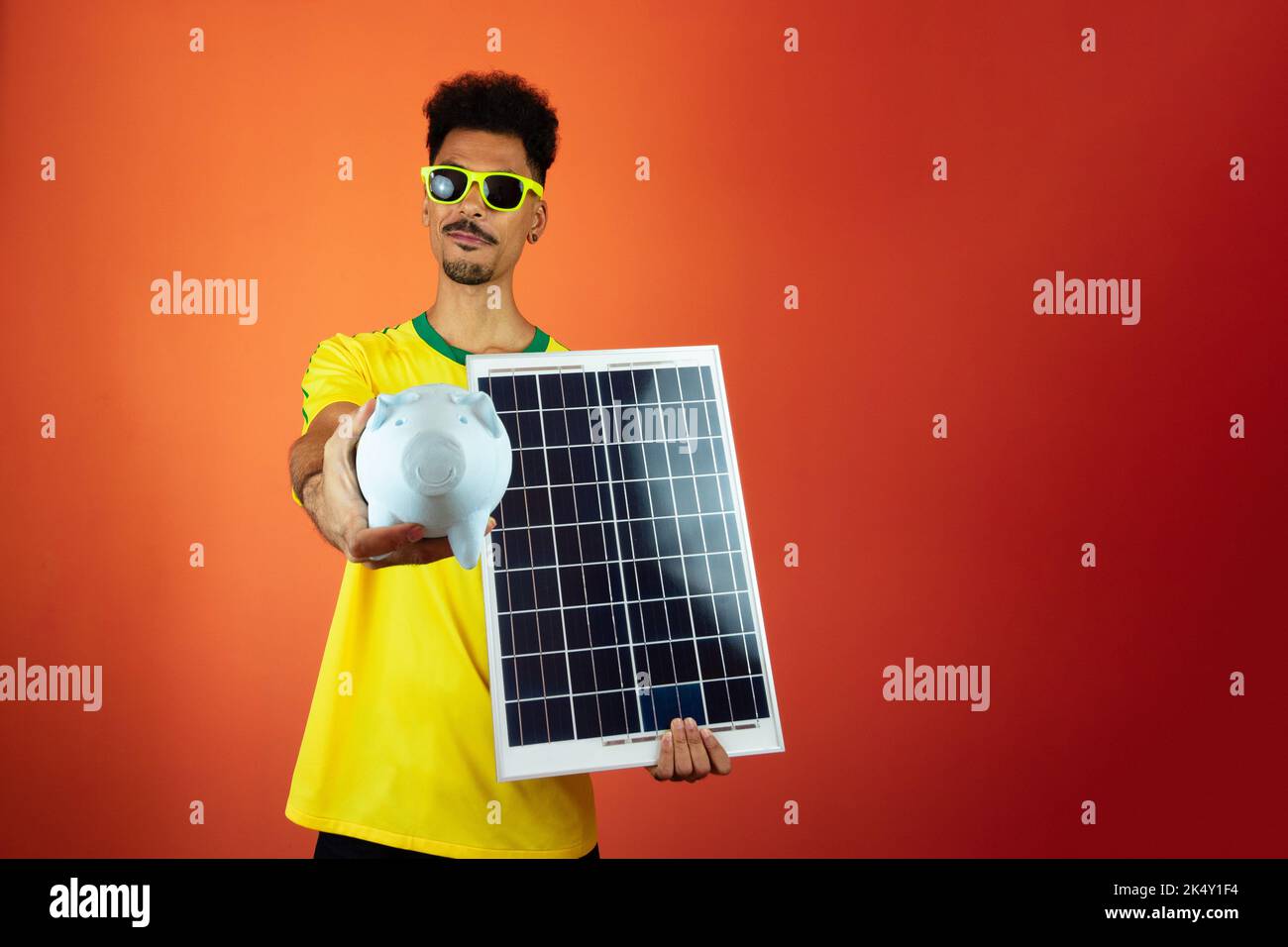 Soccer Player - Black Man Celebrating Holding Solar Photovoltaic Panel ...