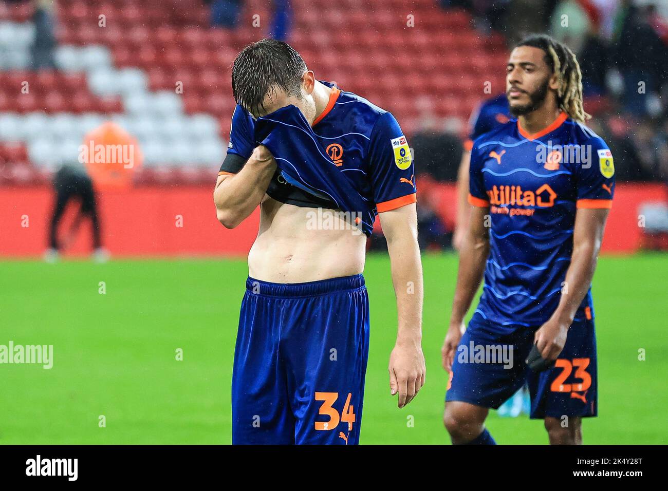 Jordan Thorniley #34 of Blackpool is dejected at the end of the Sky Bet ...