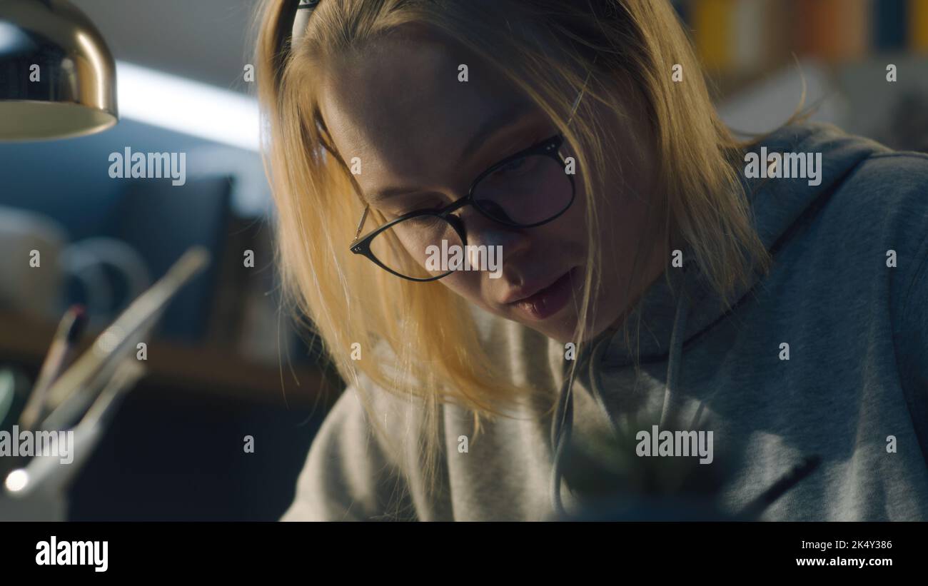 Closeup face of female creative designer draws a sketch for a comic ...