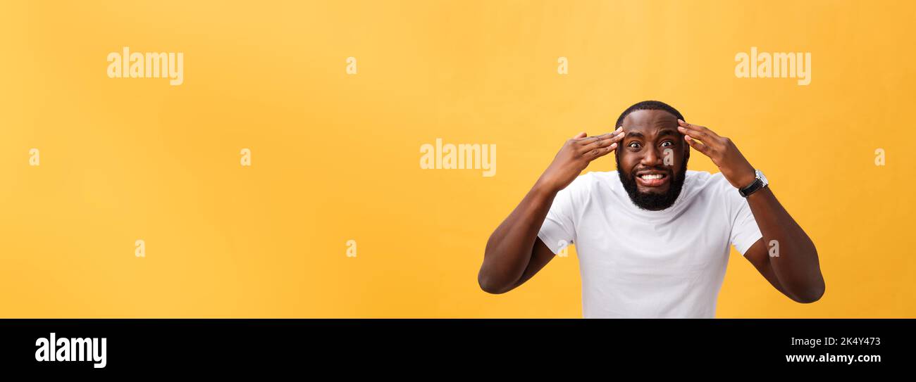 Portrait of african american man with hands raised in shock and ...