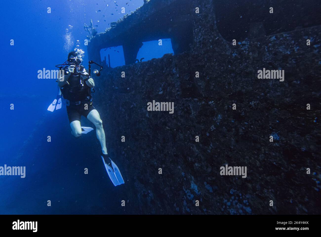 Scuba diver exploring the interior of a shipwreck Chrisoula K on ...
