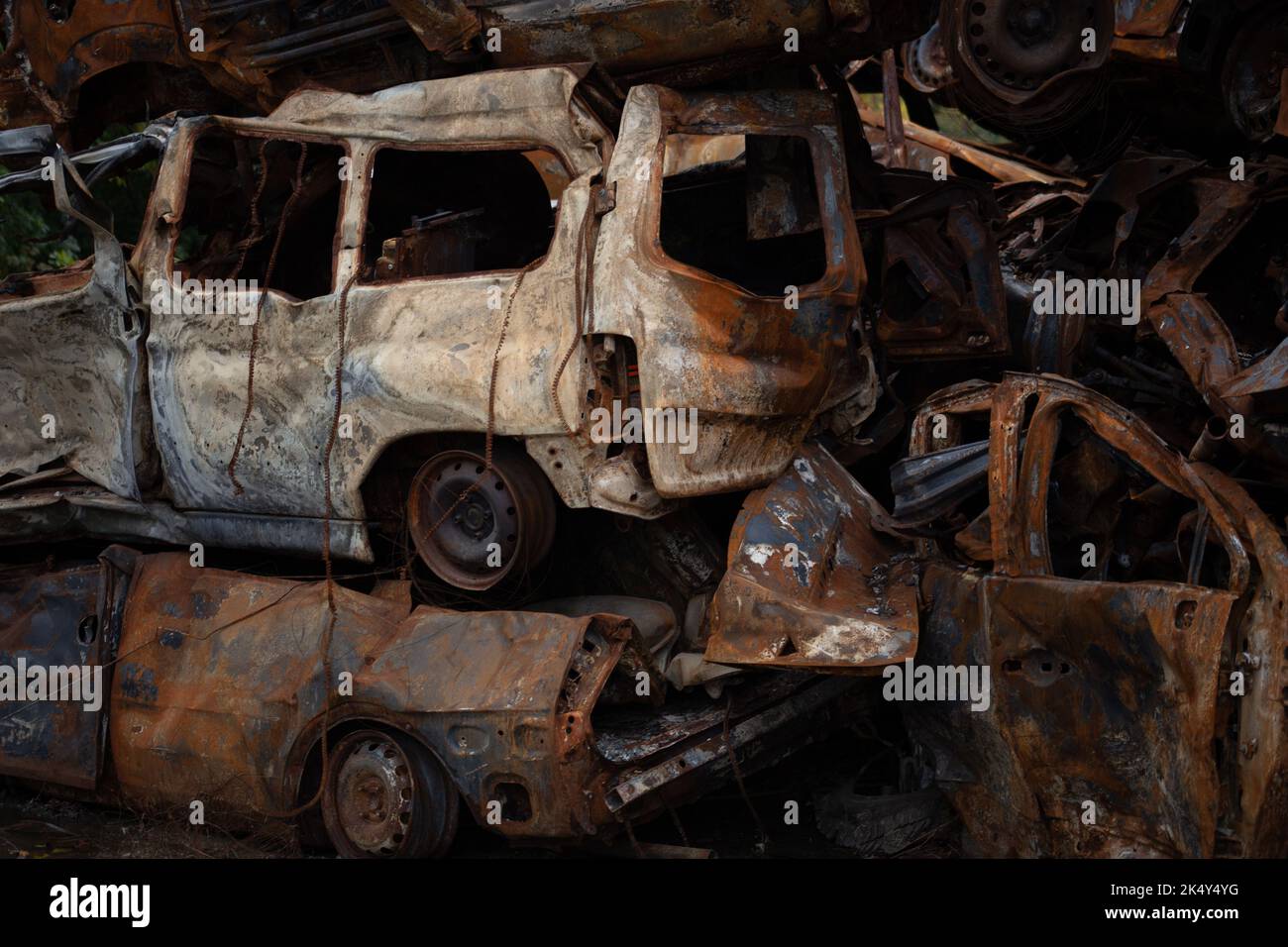 A bunch of wrecked and burned civilian cars in the city of Gostomel ...