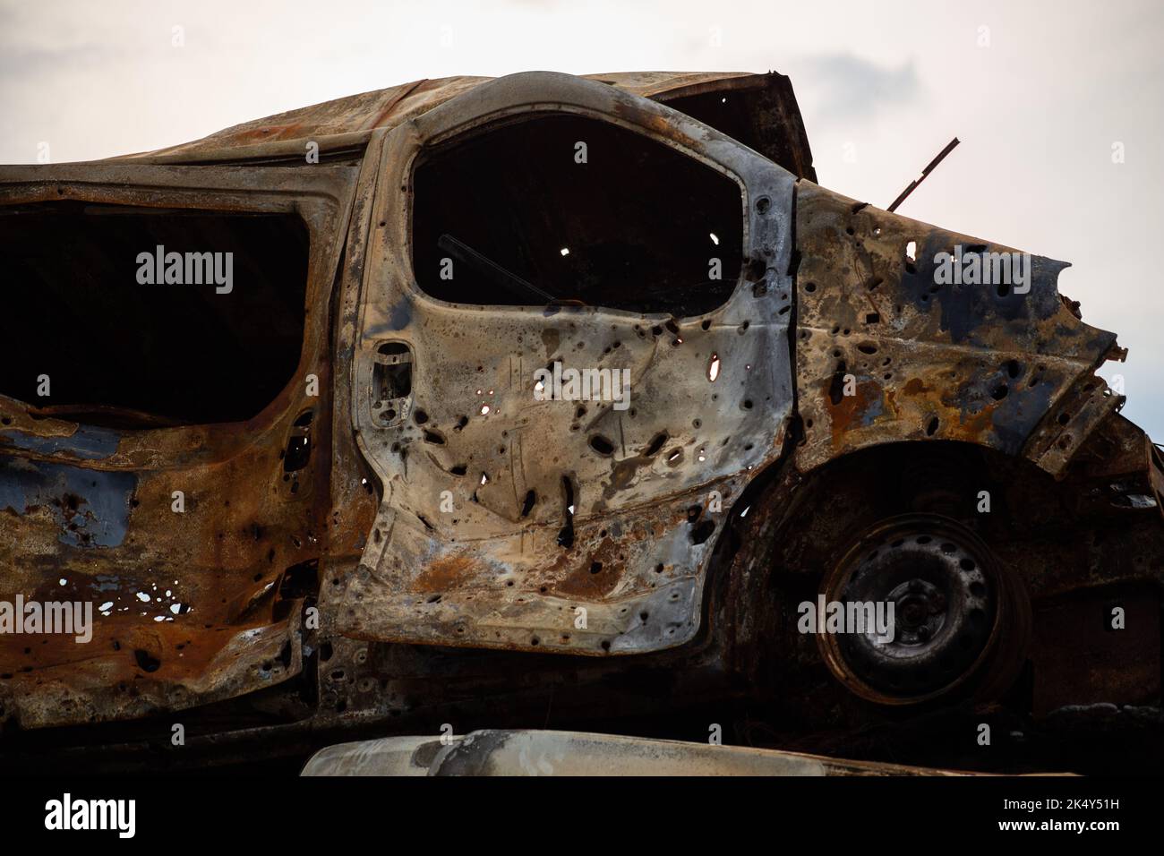 A bunch of wrecked and burned civilian cars in the city of Gostomel ...