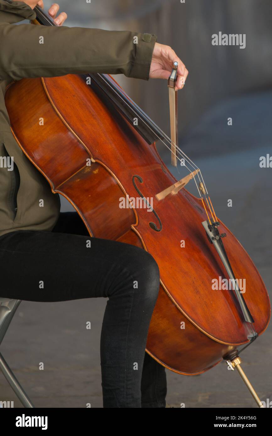 Unrecognizable person playing cello on the street. Paris Stock Photo ...
