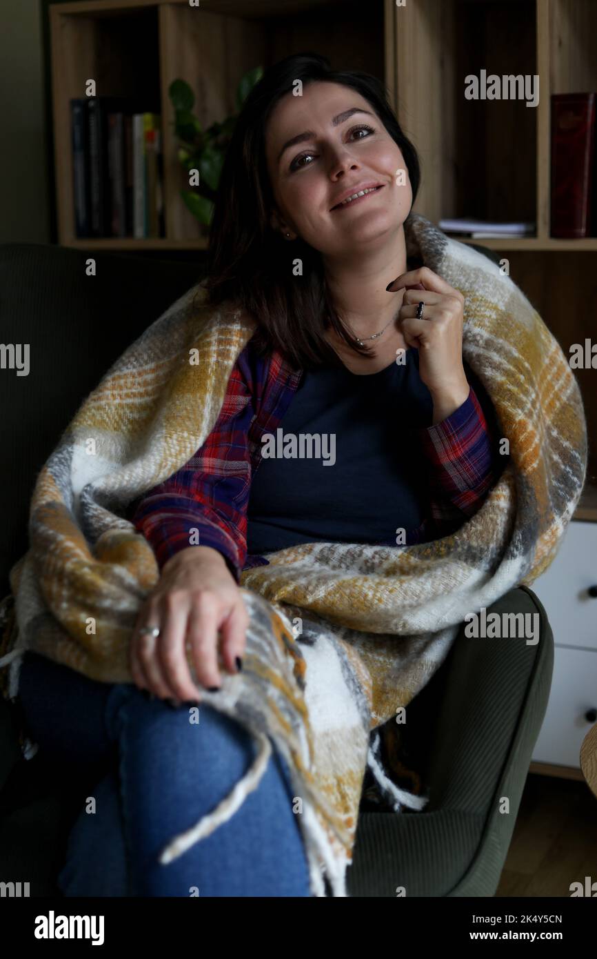 Vertical mature glad, calm pretty brunette woman with toothy smile ...