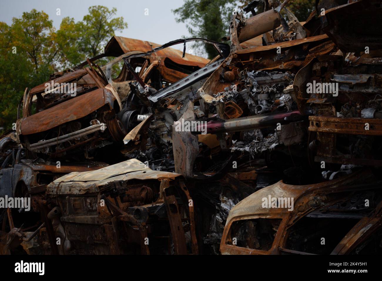 A bunch of wrecked and burned civilian cars in the city of Gostomel ...