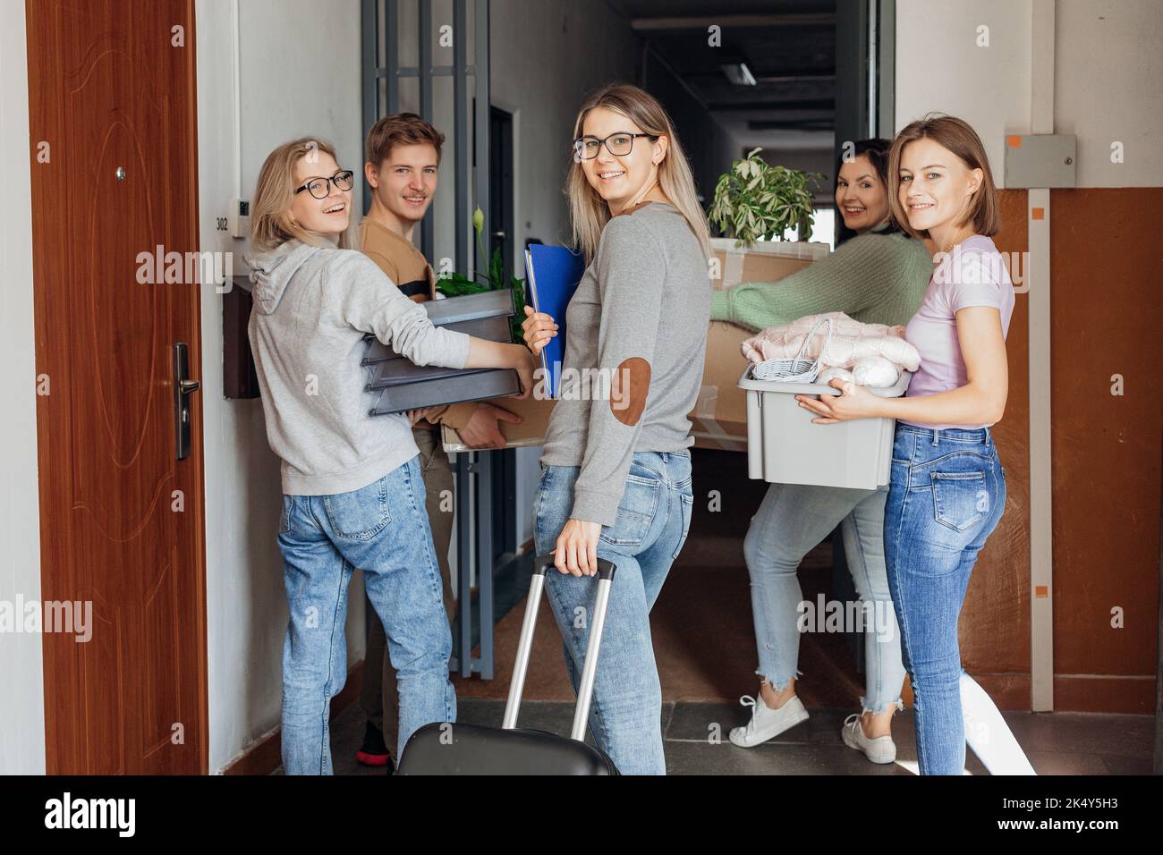 Positive, energetic cheerful women and man moving out office, business ...