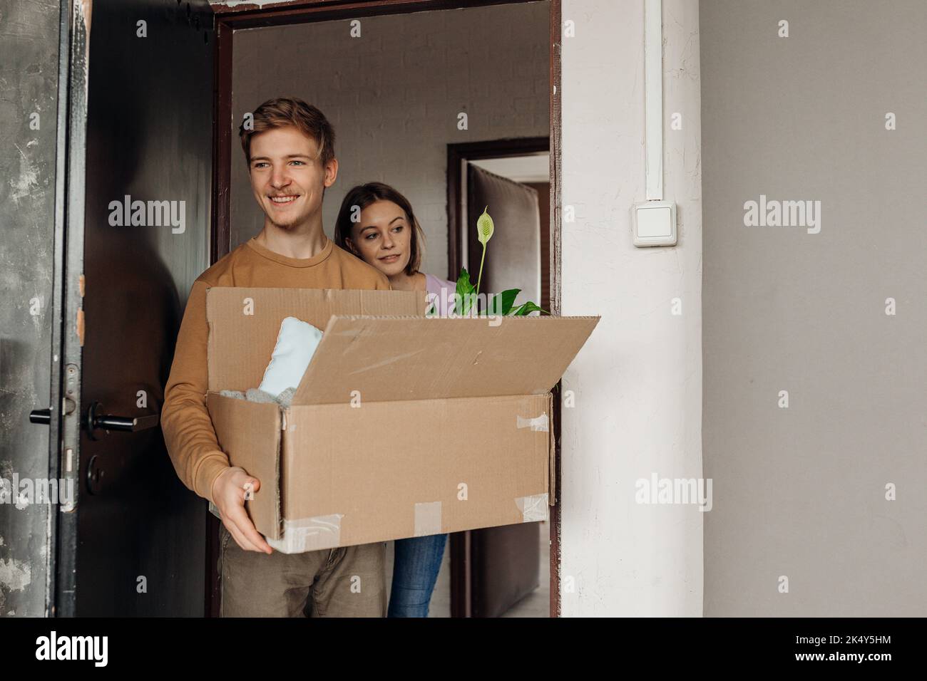 Vertical smiling, curious, communicative students newbies taking carton ...