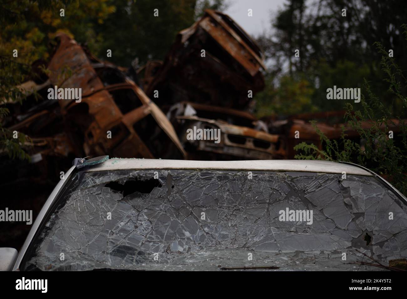 A bunch of wrecked and burned civilian cars in the city of Gostomel ...