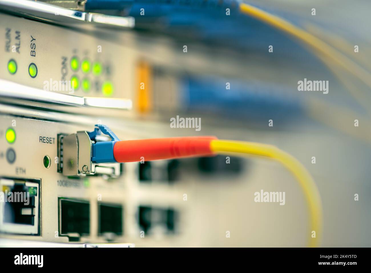 Optical Line Terminal with Connected Fiber Optic Patch Cords Close-up ...