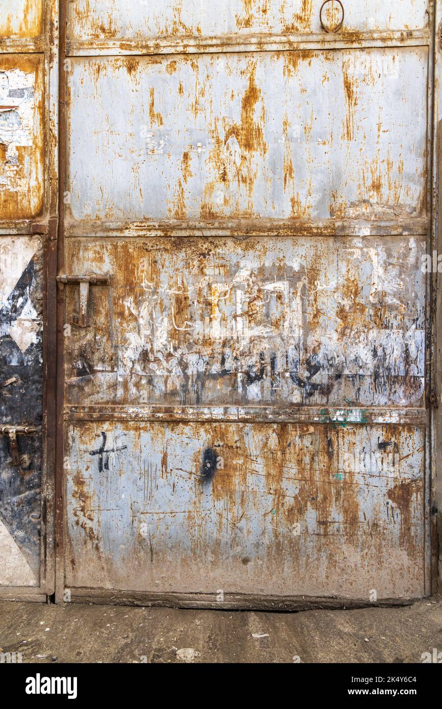 Manshiyat Naser, Garbage City, Cairo, Egypt. Rusted metal door on a ...
