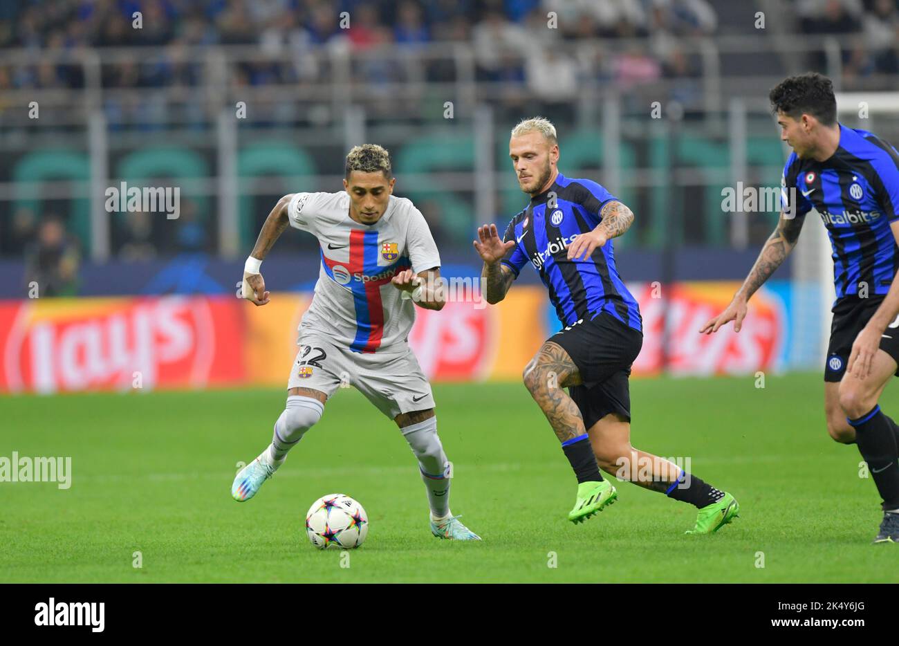 Milano, Italy. 04th Oct, 2022. Raphinha (22) of Barcelona and Federico Dimarco (32) of Inter ...
